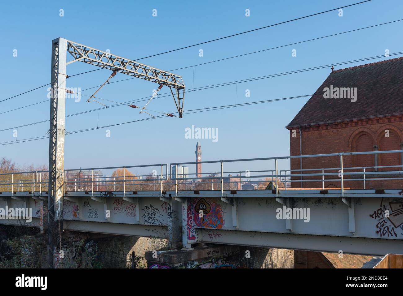 Power cables suspended over railway for electric train Stock Photo - Alamy