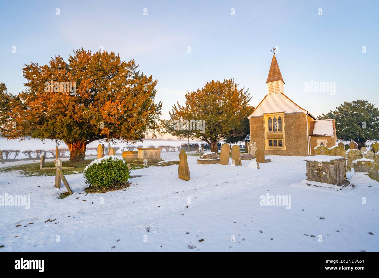 St MargaretÕs church Ifield, Gravesend Kent at sunset on a snowy ...