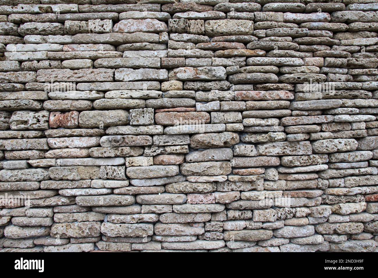The wall is built of natural stone Stock Photo - Alamy
