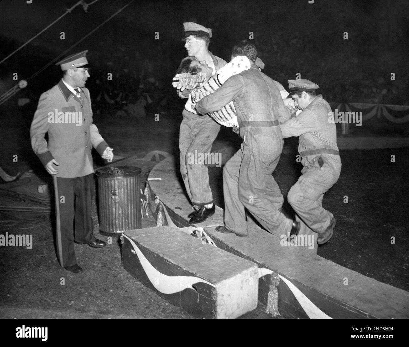Prop men at the Ringling Brothers and Barnum and Bailey Circus remove a ...