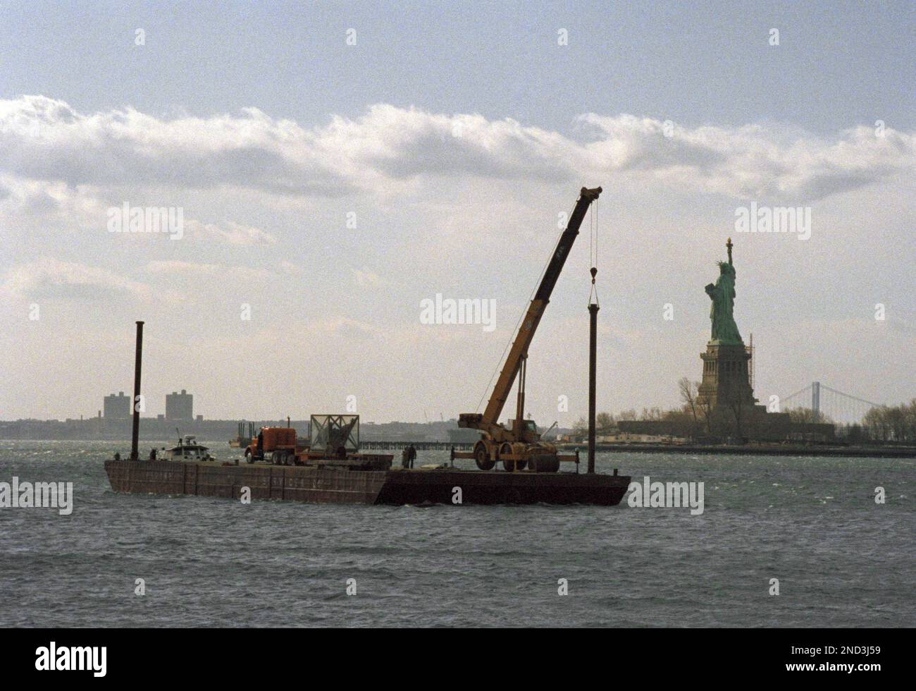Statue of Liberty’s torch, arrives by barge from Liberty Island, en ...