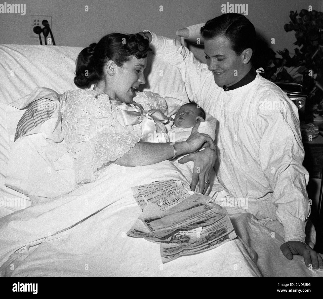 Singer Pat Boone, wearing hospital gown, and wife, Shirley, admire ...