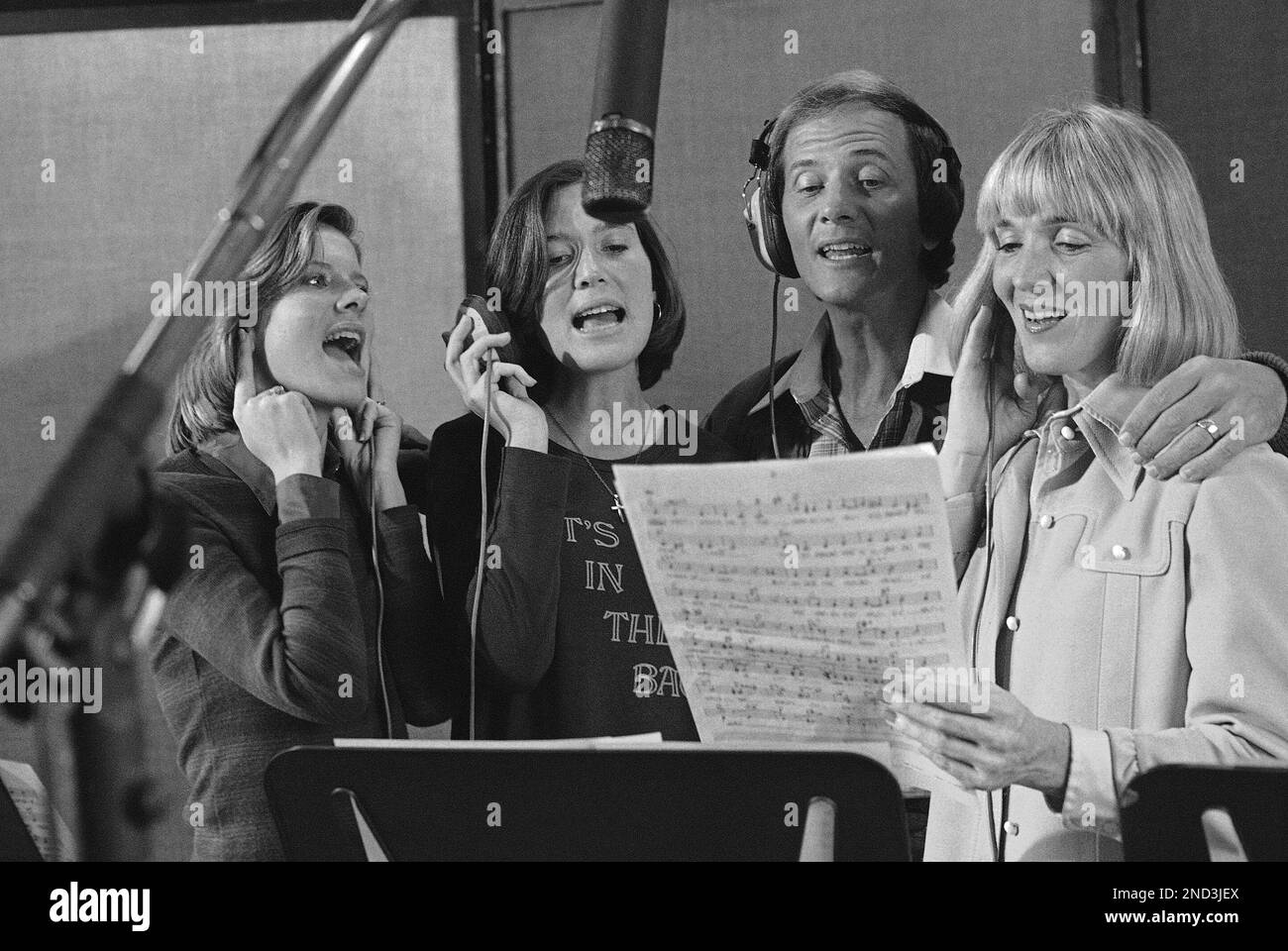 Singer Pat Boone (second from right) steadies his wife, Shirley, as if ...