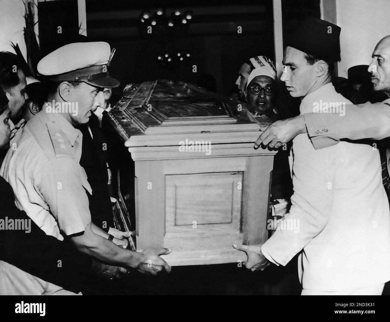 The new Aga Khan IV, Prince Karim, right, helps carry the coffin ...