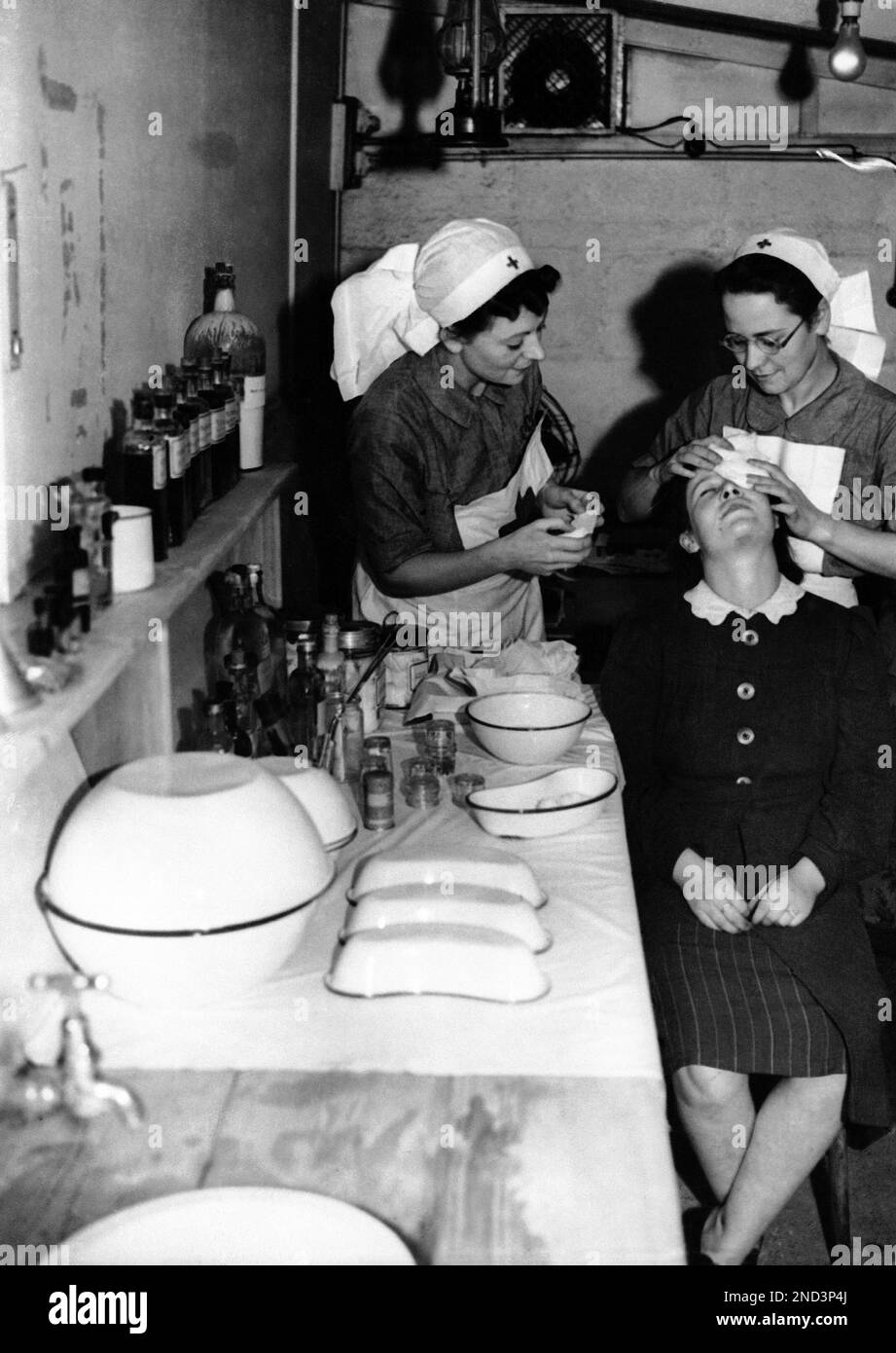 Nurses attend a patient in the fully-equipped first aid station in ...