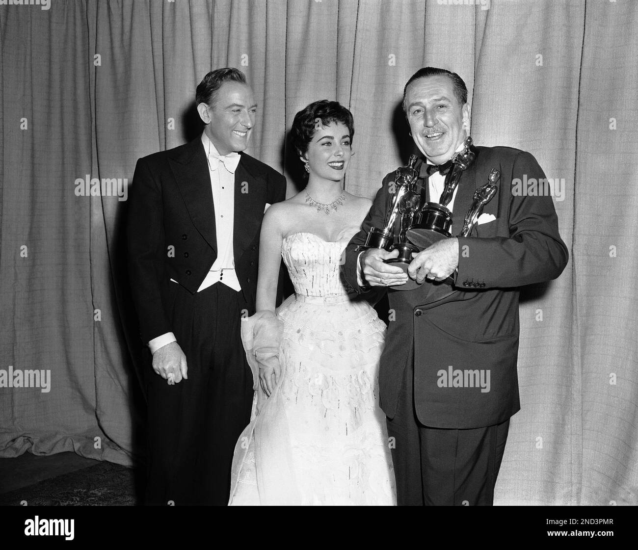 Walt Disney displays four Oscars he won at 26th annual Academy Awards ...