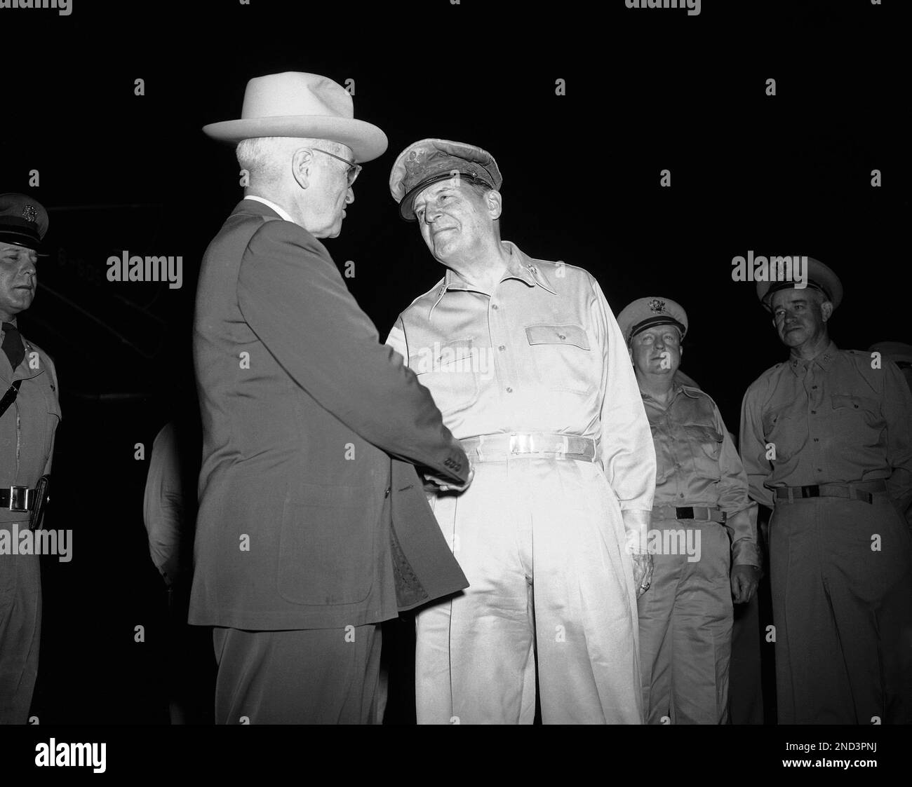 President Harry Truman (right) greets Gen. Douglas MacArthur upon the ...