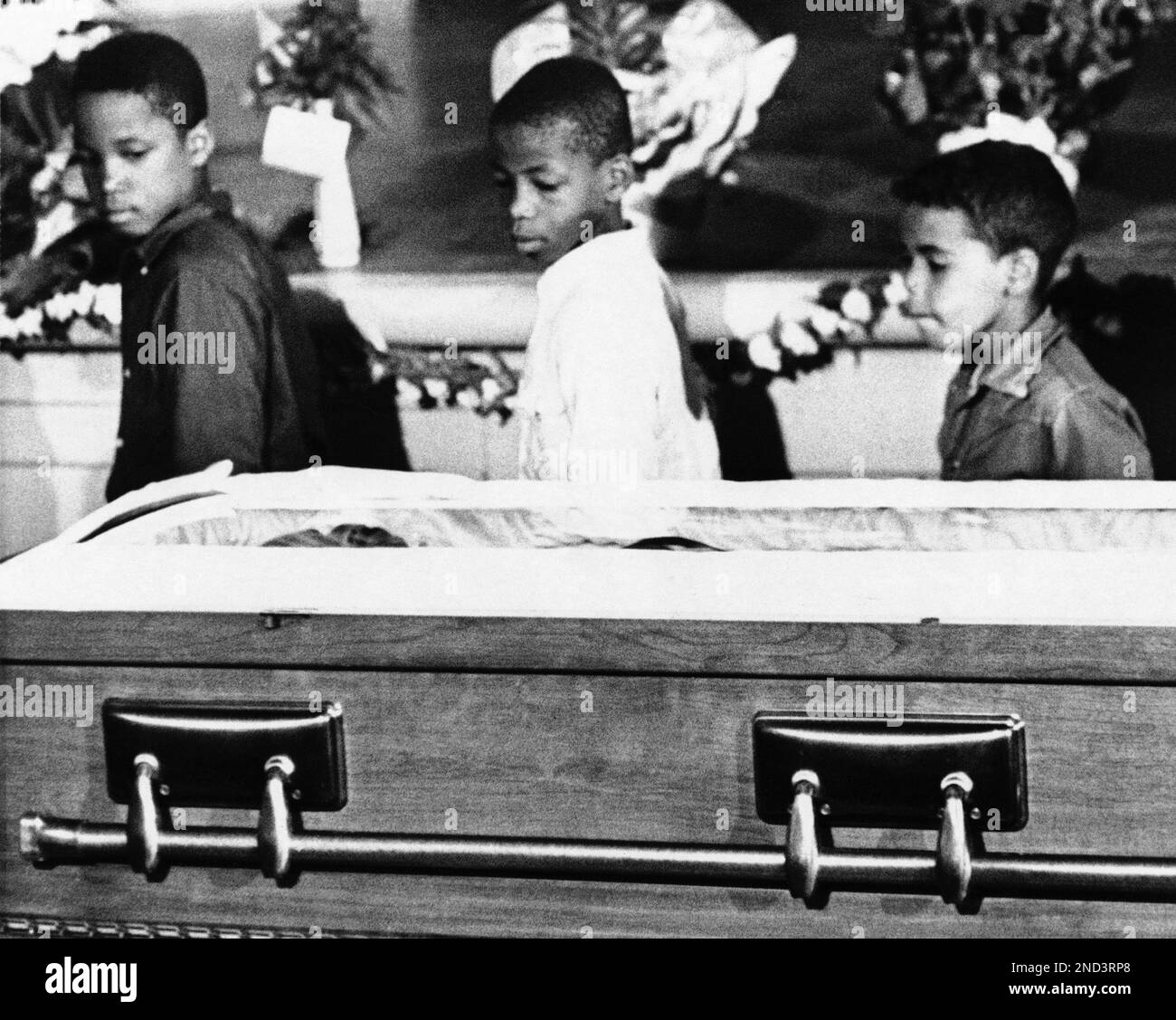 Children pass the bier of slain civil rights leader Dr. Martin Luther ...