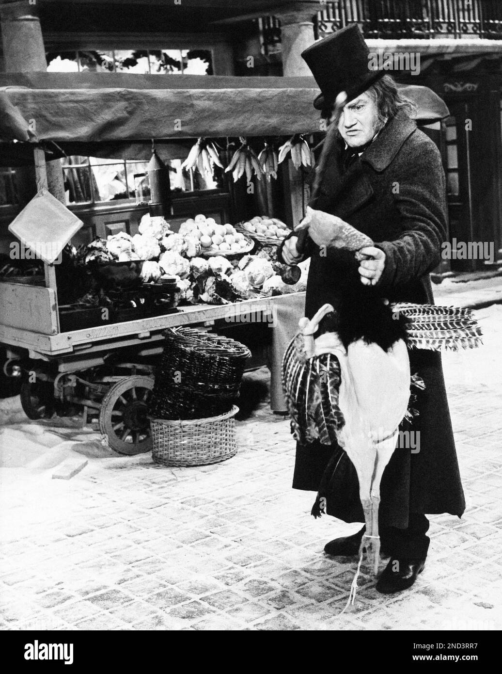 British actor Albert Finney holds a Turkey in a scene of “Scrooge” on a ...
