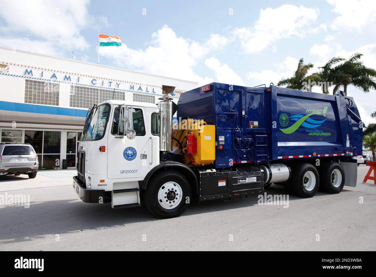 The Autocar E3 hybrid waste disposal truck is shown in front of City ...