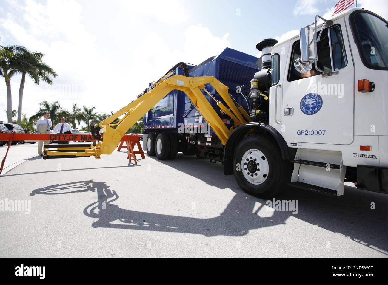 The Autocar E3 hybrid waste disposal truck is shown in front of City ...