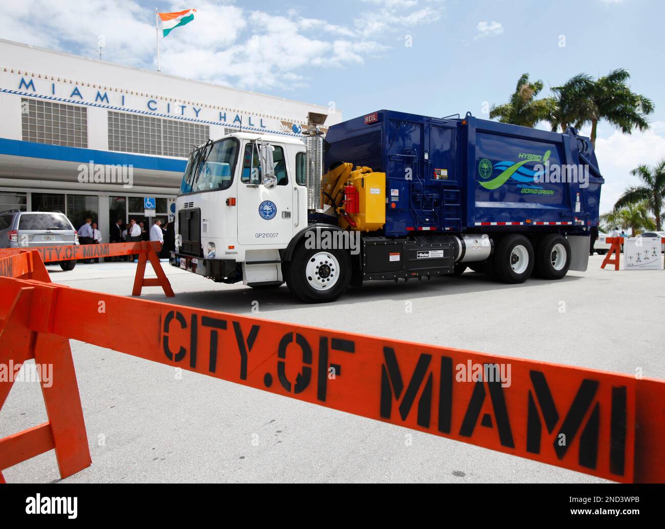 The Autocar E3 hybrid waste disposal truck is shown in front of City ...