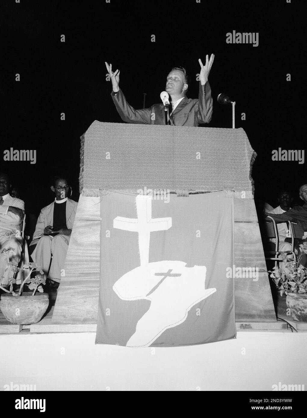 Billy Graham, the American evangelist, addresses a rally of 14,000 ...