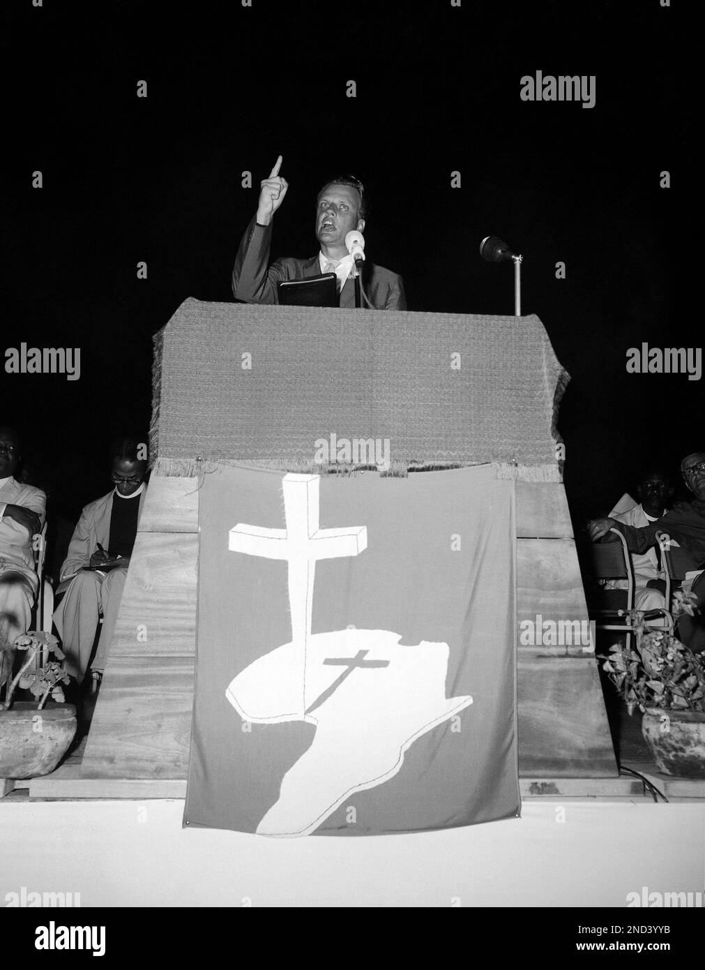 Billy Graham, the American evangelist, addresses a rally of 14,000 ...