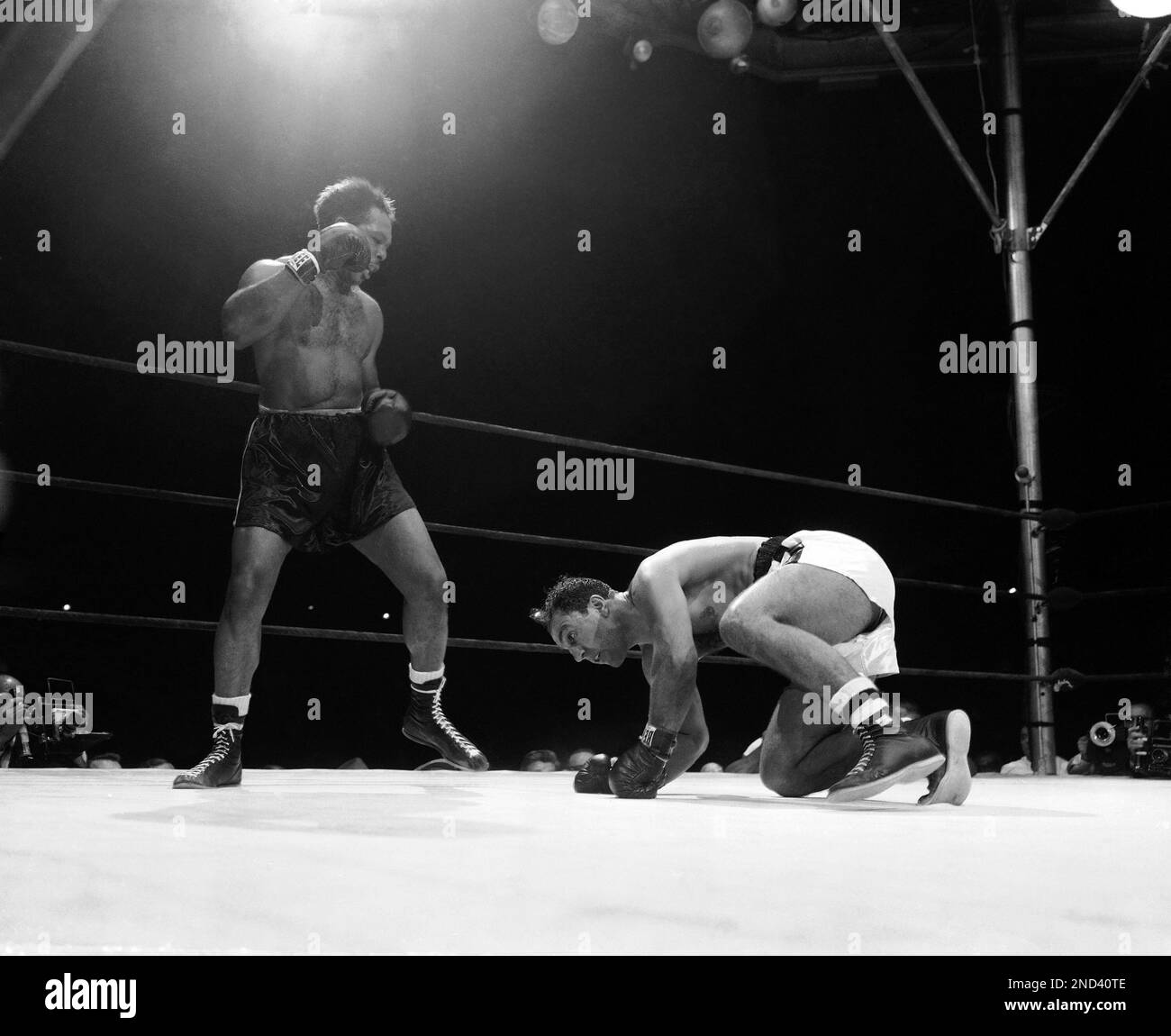 Challenger Archie Moore stands over world heavyweight champ Rocky ...