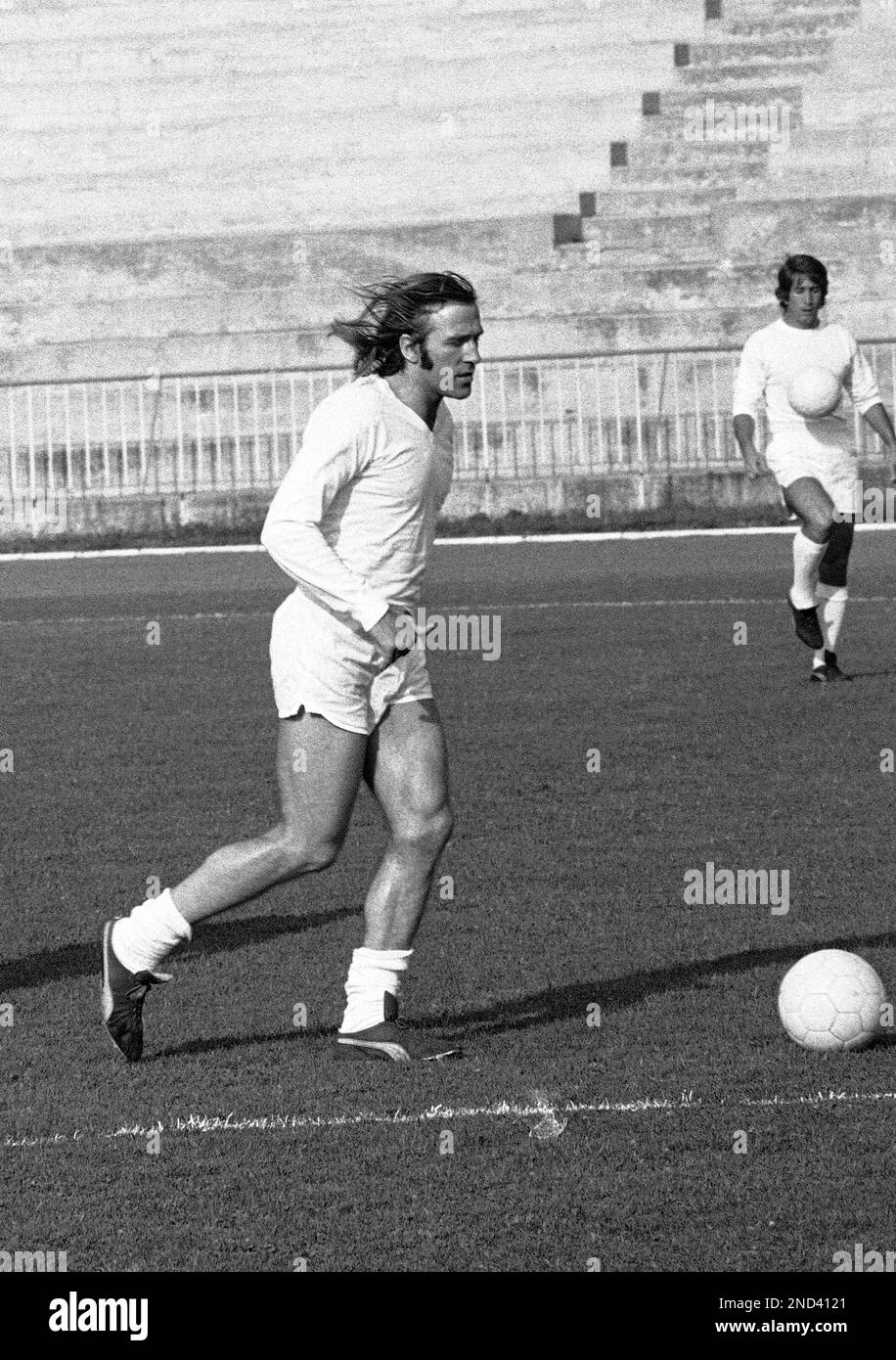 German soccer star Guenter Netzer runs during a training session with ...