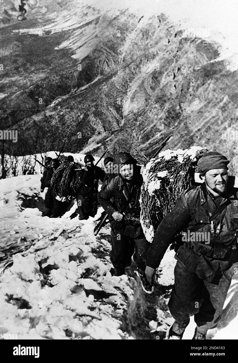 Soldiers of the Alpini Division transporting barbed wire for the ...