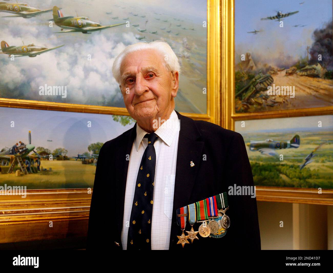 Ken Wilkinson an RAF veteran is seen by paintings of spitfires in ...