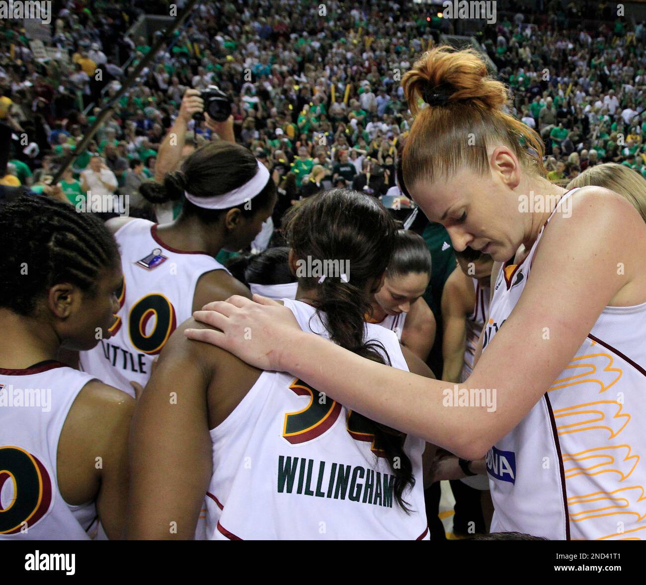 Seattle Storm's Lauren Jackson, right, huddles with teammates after ...