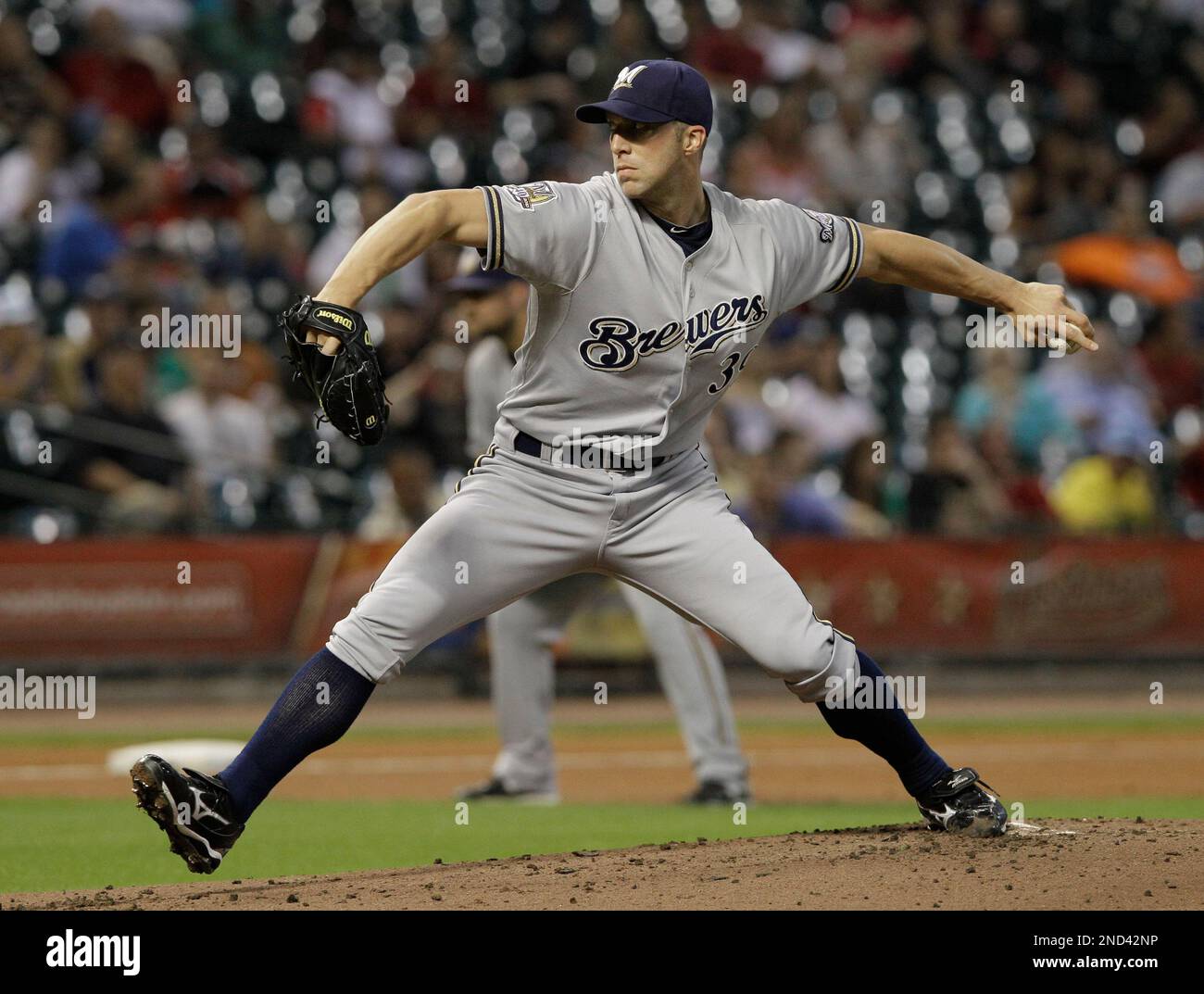 Milwaukee Brewers' Chris Capuano delivers a pitch in the first inning ...