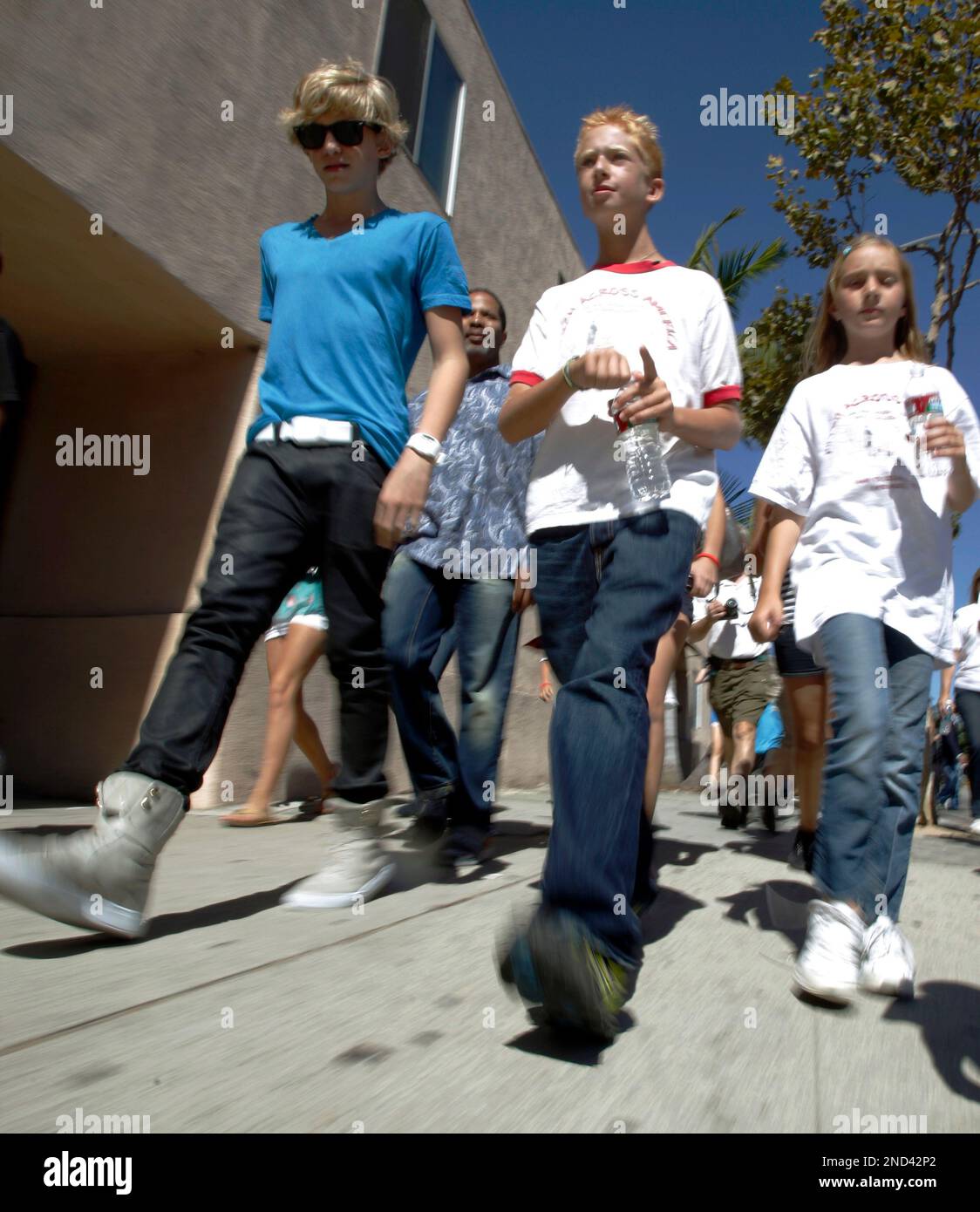 Zach Bonner, 12, of Tampa, Fla., center, and singer Cody Simpson, left ...