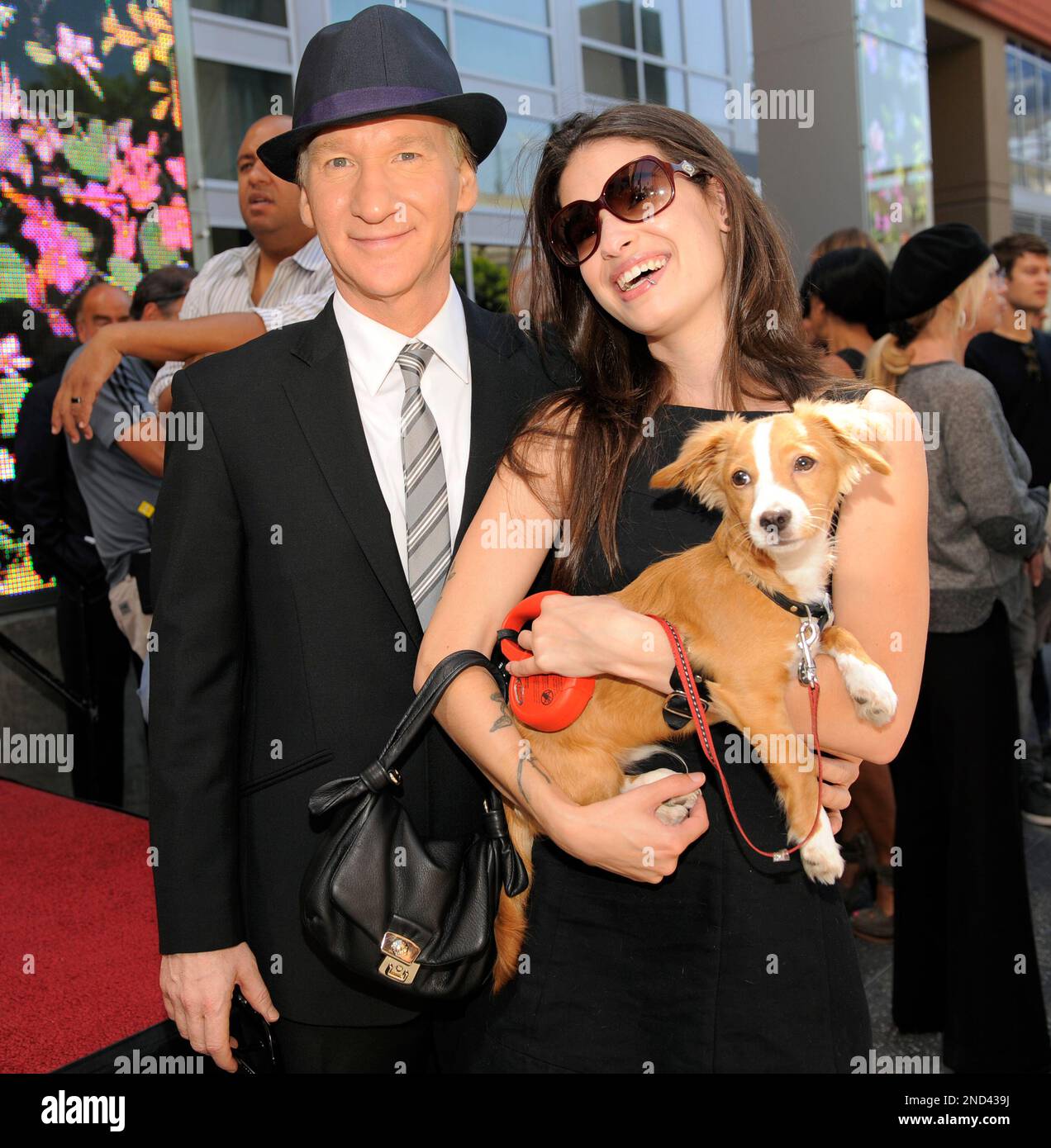 Bill Maher, left, poses with girlfriend Cara Santa Maria and their dog ...