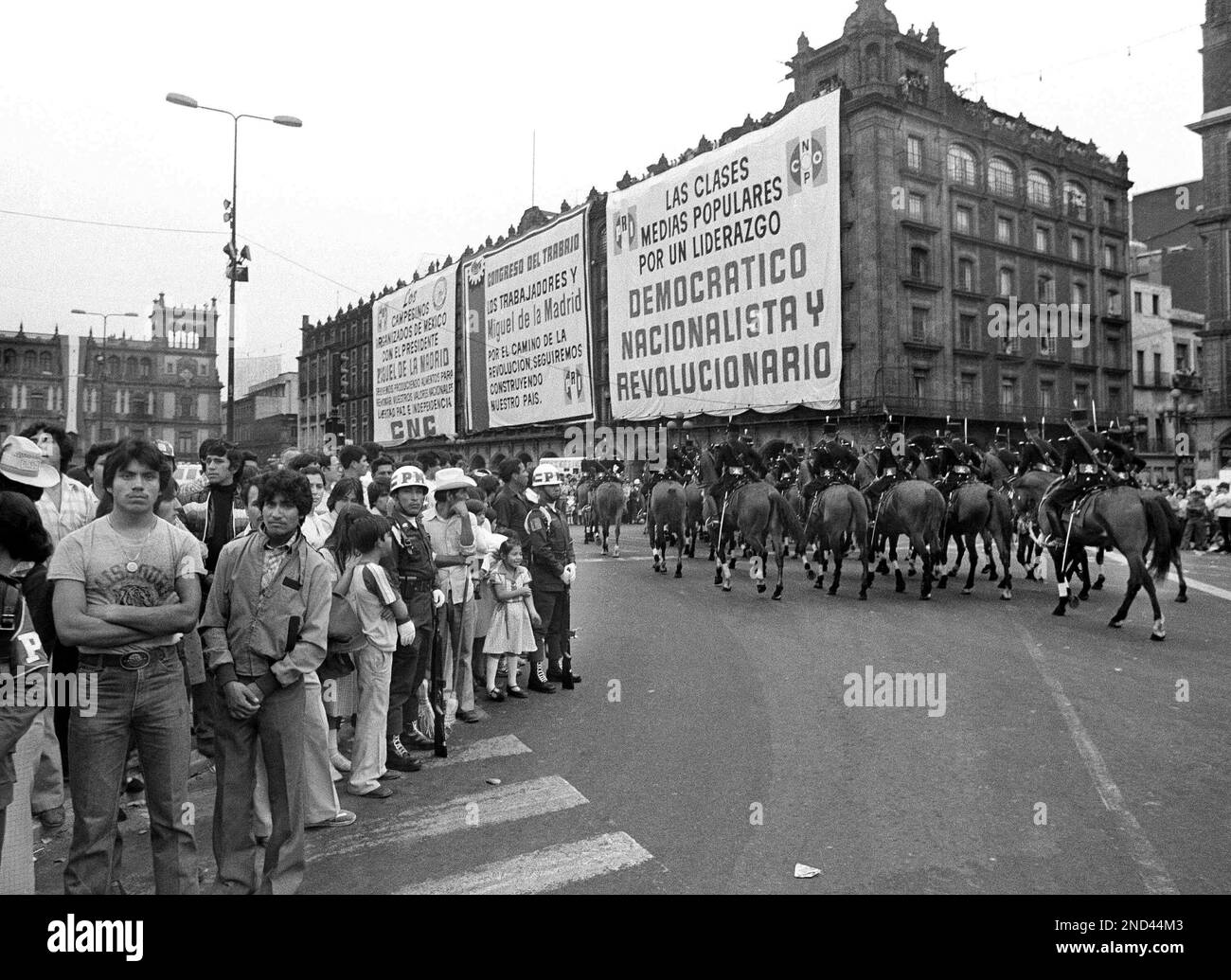 Mexican troops pass by the reviewing stand of newly inaugurated ...