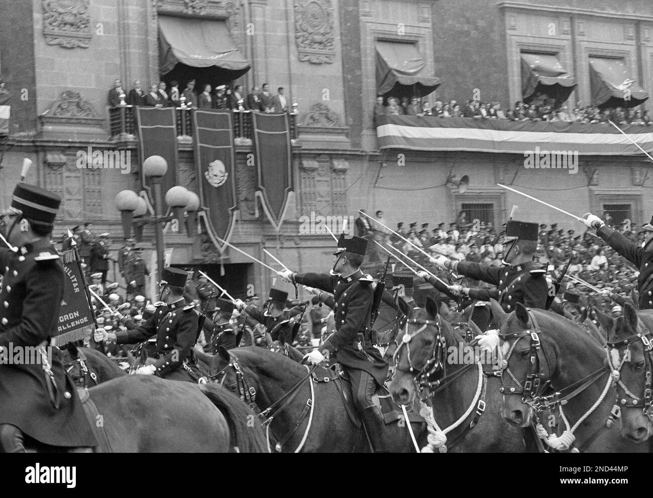 Mexican troops pass by the reviewing stand of newly inaugurated ...