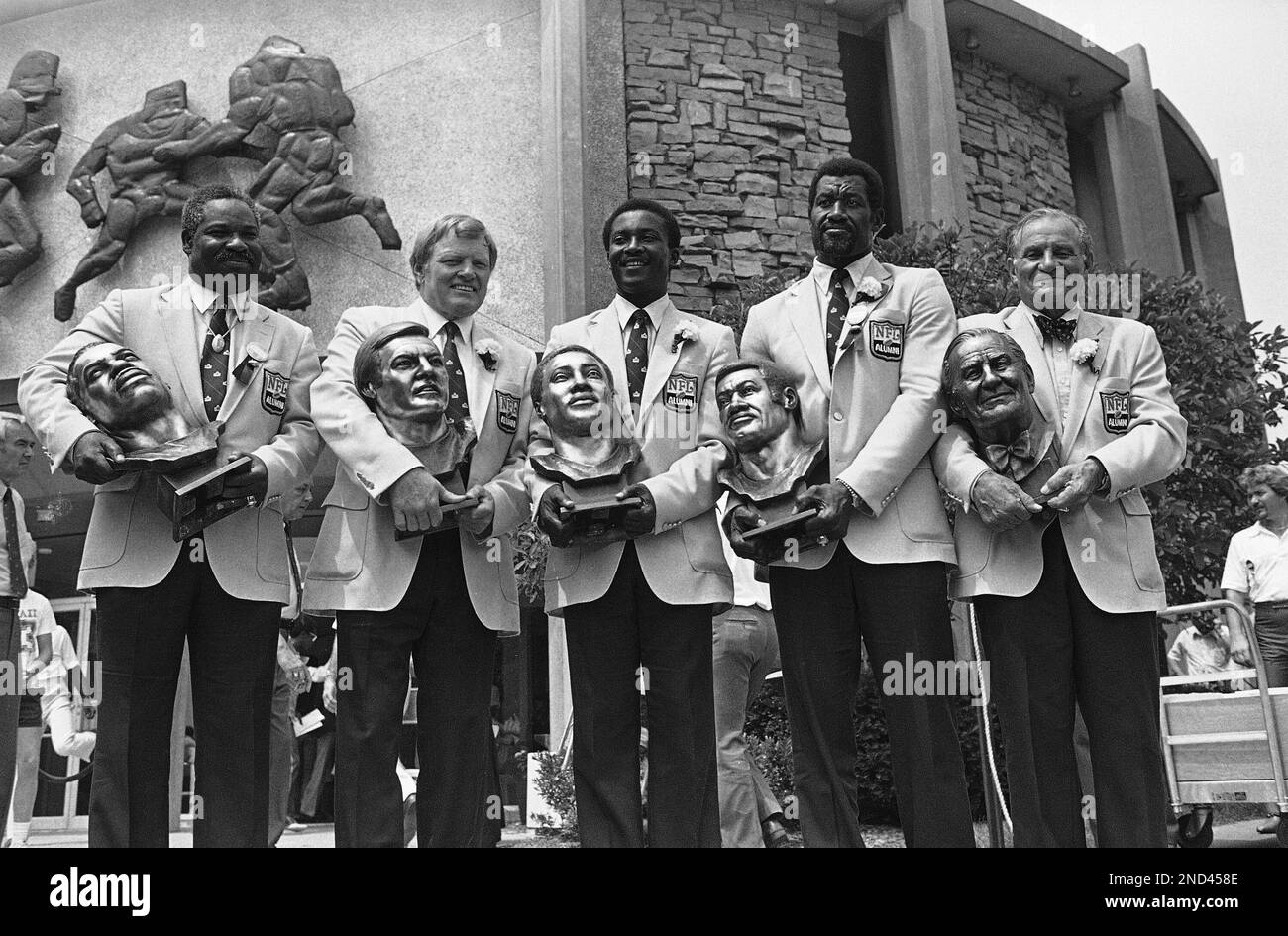 The five inductees into the Pro Football Hall of Fame pose outside the ...