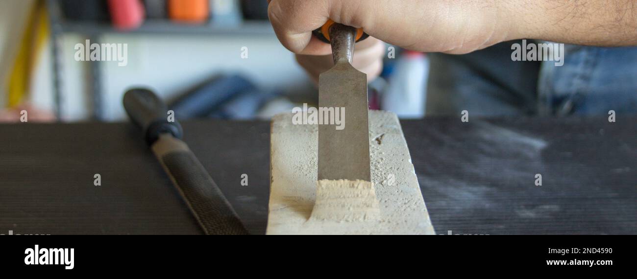 Image of a handyman craftsman's hands holding a carpenter's hammer and ...
