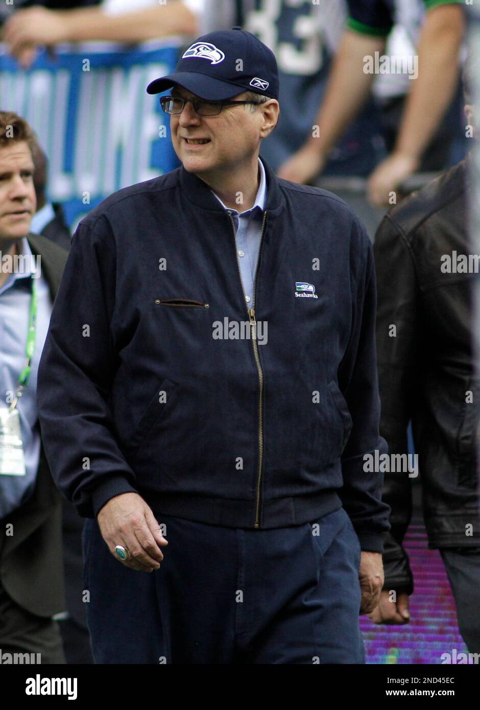 Seattle Seahawks owner Paul Allen walks on the field at the end of an ...