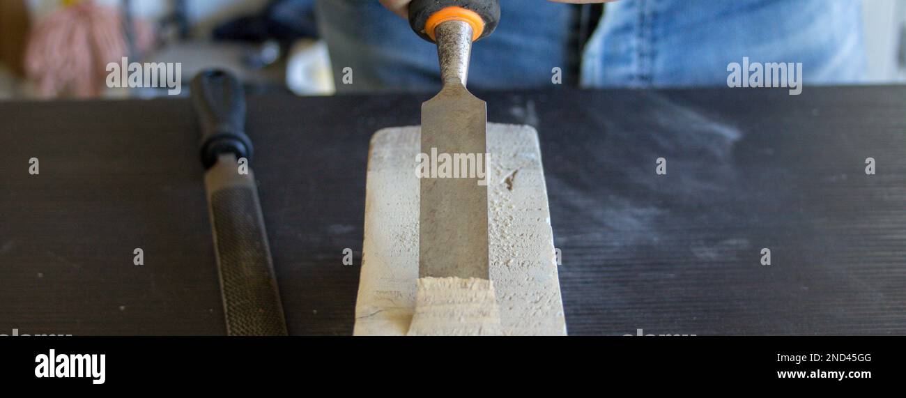 Image of a handyman craftsman's hands holding a carpenter's hammer and ...