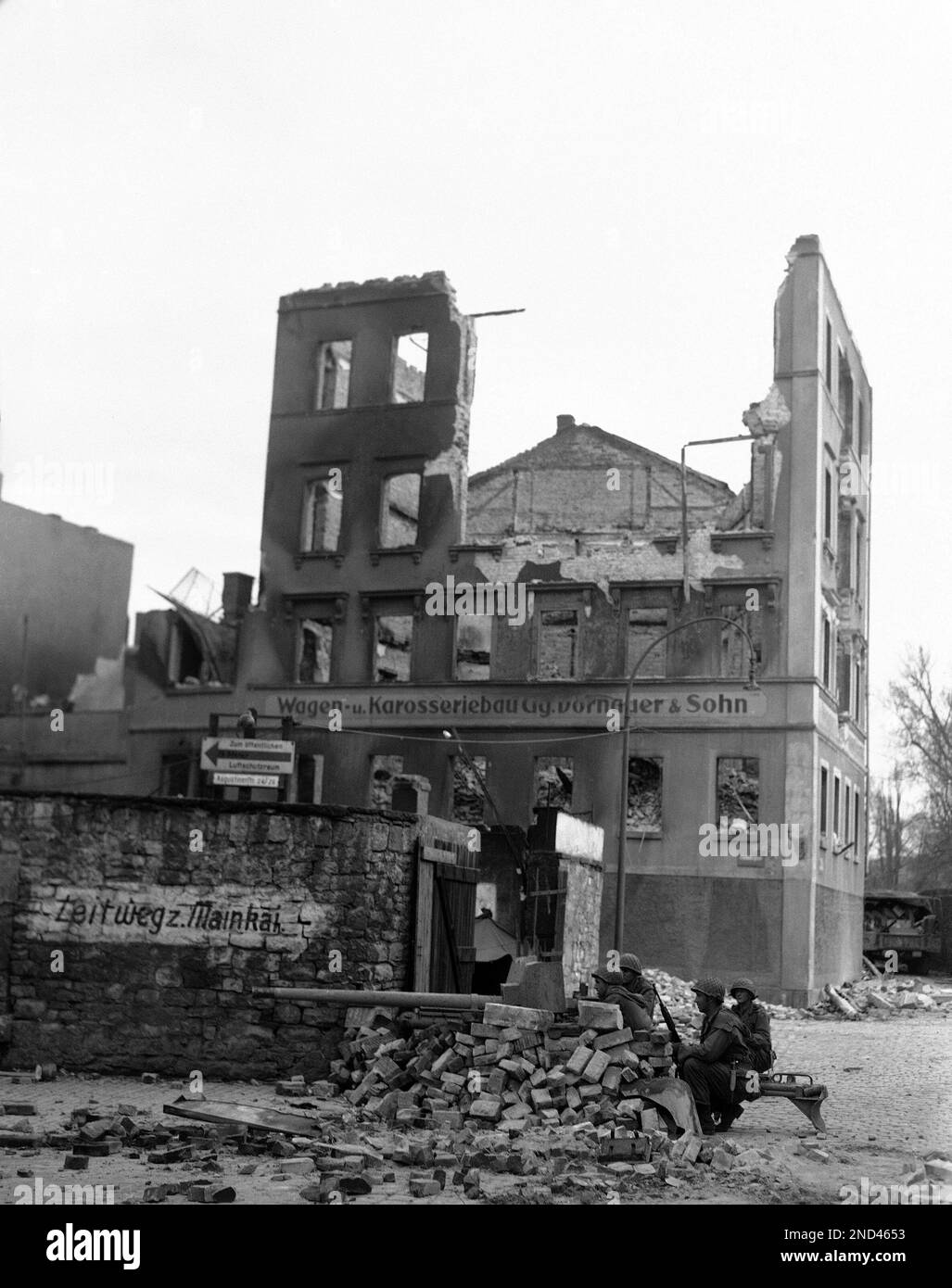 Manning a 57mm anti-tank gun during the bitter street fighting which ...
