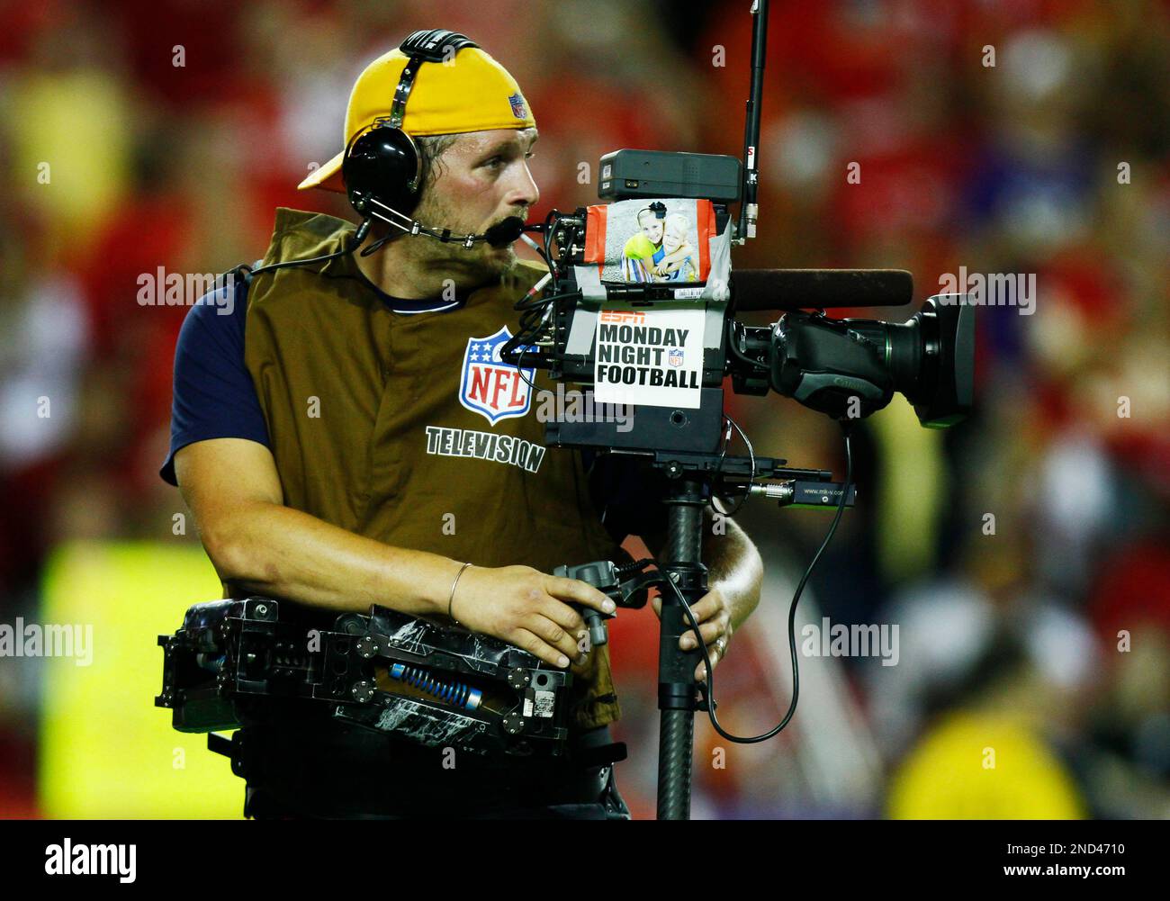 A TV cameraman during the first half of an NFL football game between ...