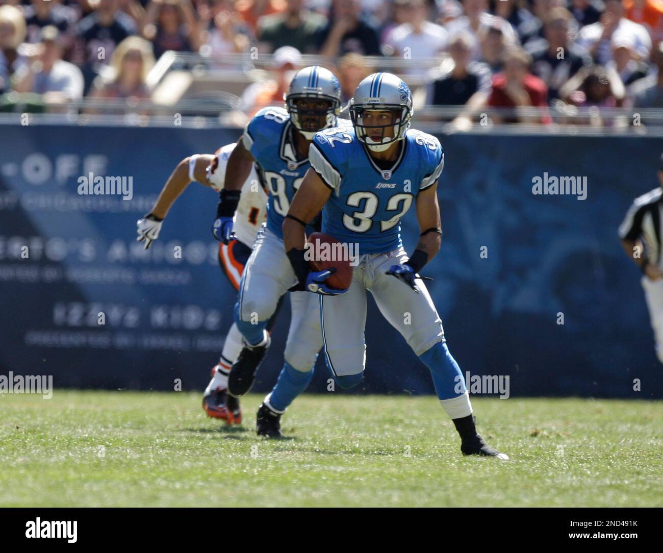 Detroit Lions' Aaron Berry (32) runs with the ball in the first half of ...
