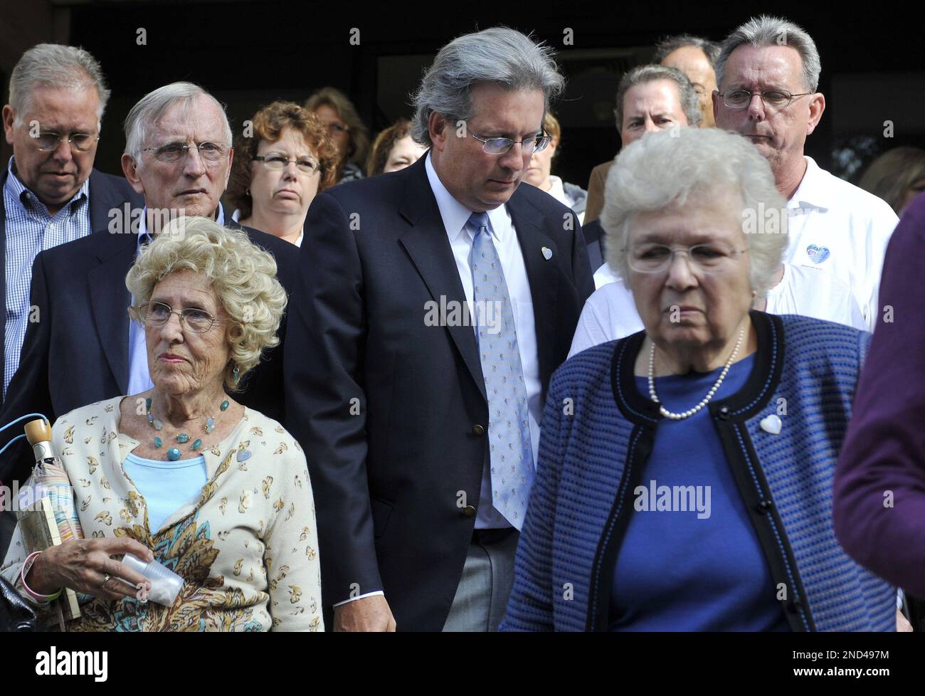 Surrounded by family, Dr. William Petit Jr., center, leaves court after ...