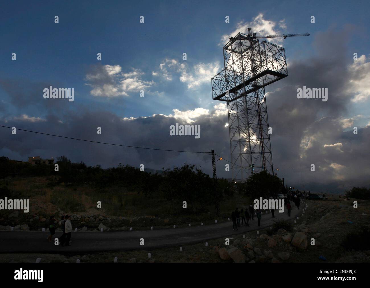 Observant Christian, arrive to attaend a mass service under a towering ...