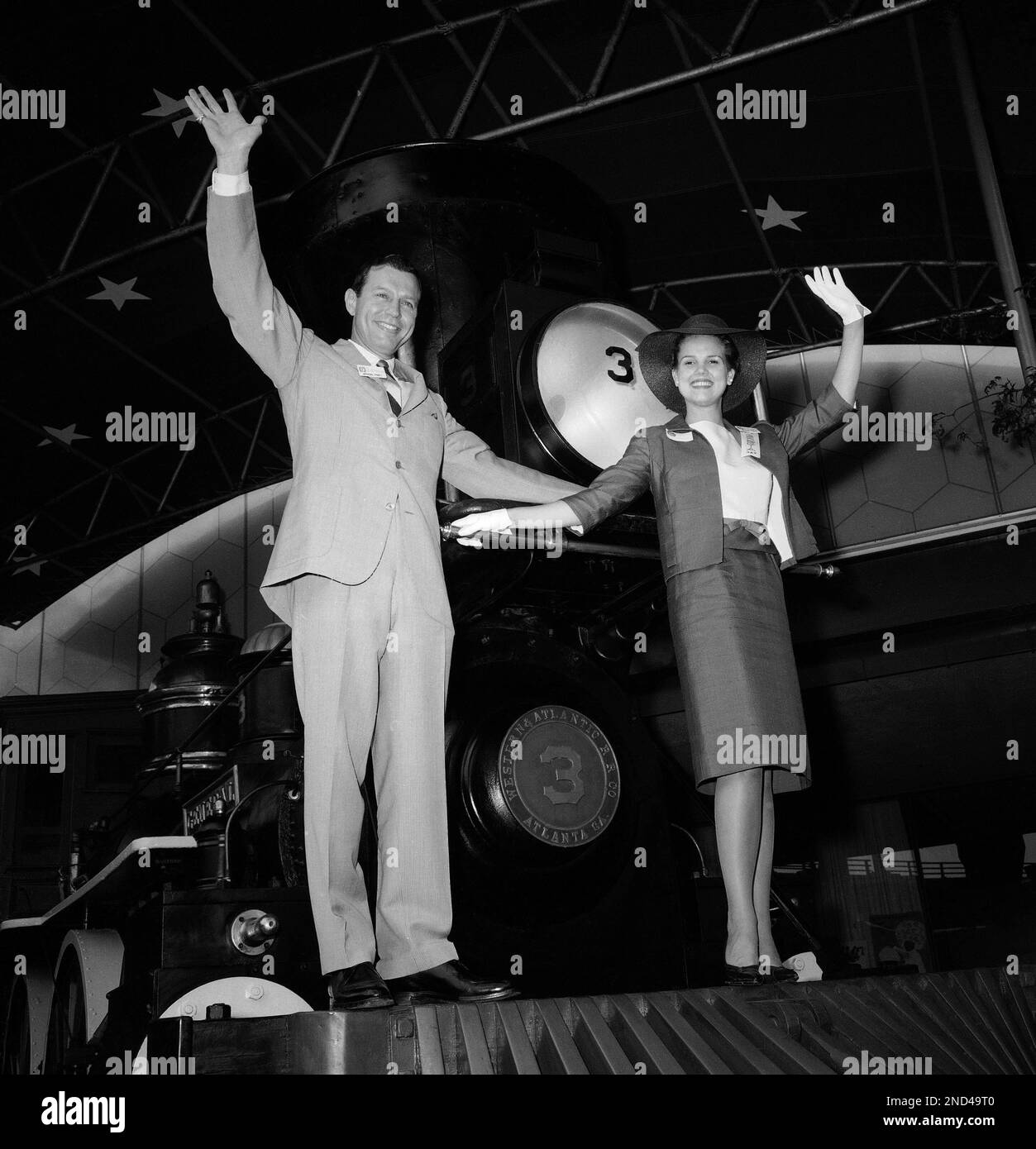 Gov. Carl E. Sanders of Georgia and Miss Georgia, Vivian Davis, wave ...