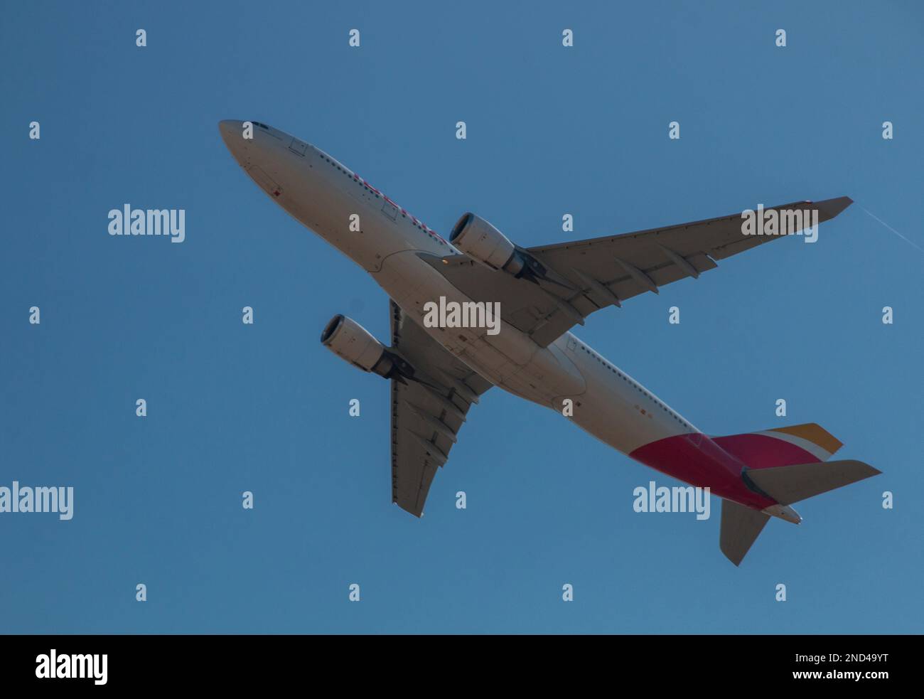 Plane ascending into the sky, flying, on its takeoff from the airport ...