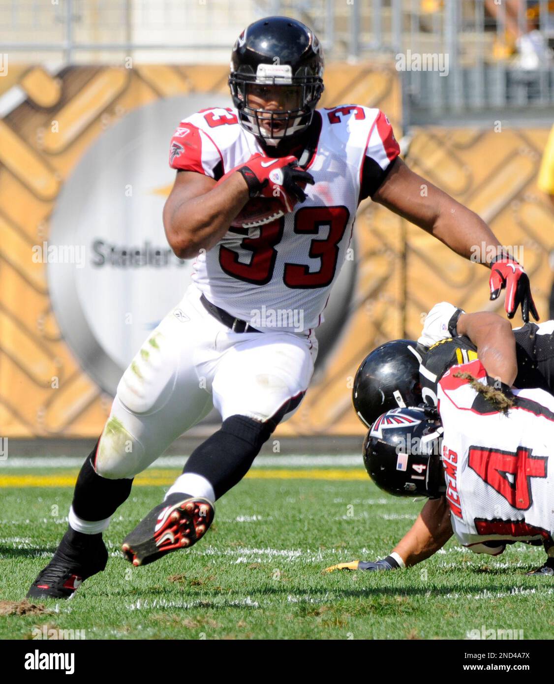 Atlanta Falcons running back Michael Turner breaks into the opening ...