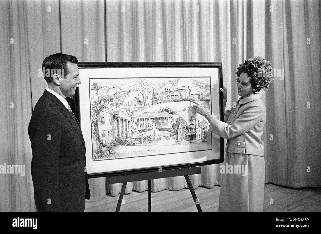 Mrs. Betty Sanders shows her husband, Georgia Gov. Carl Sanders, her ...