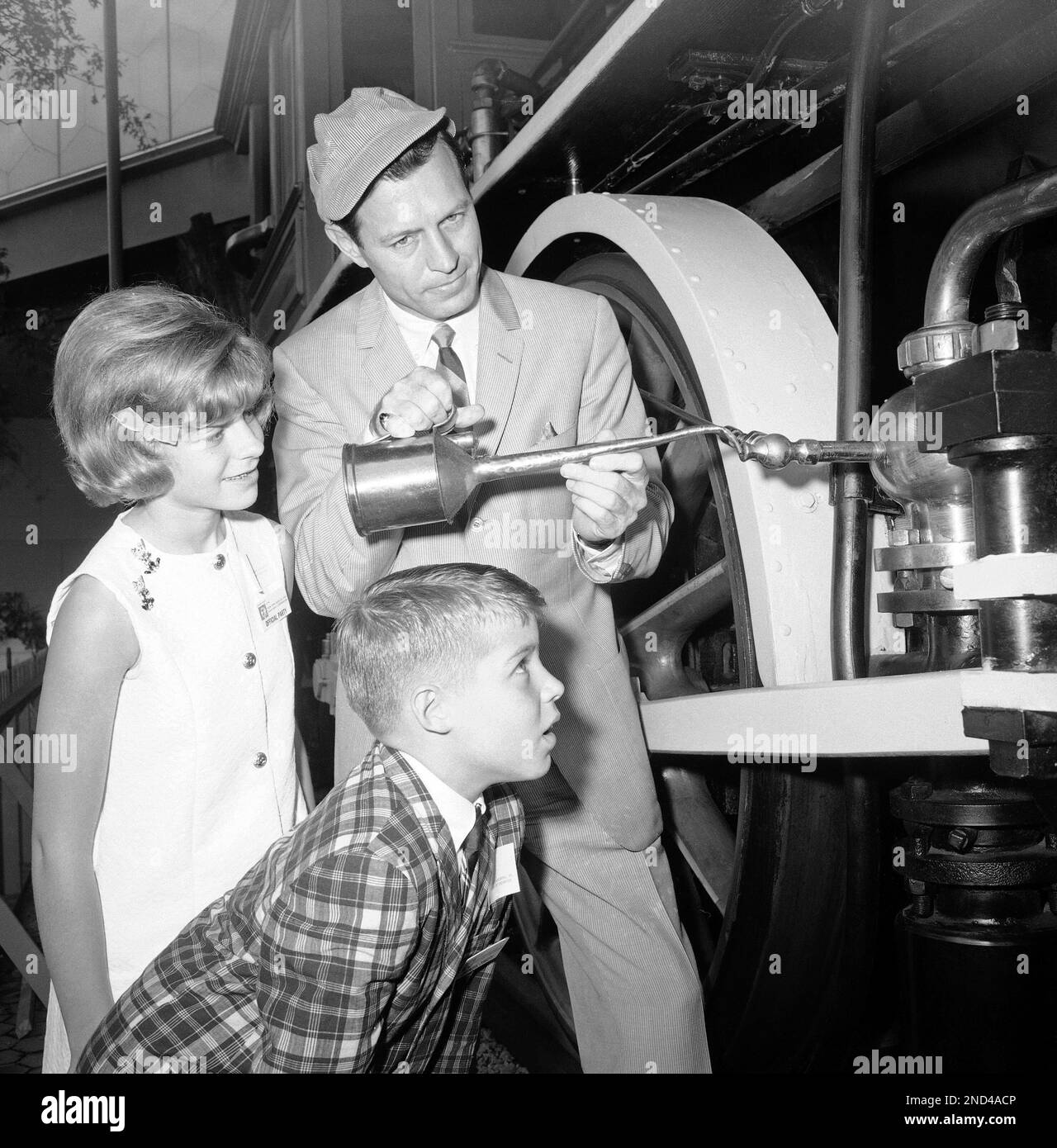 Gov. Carl E. Sanders of Georgia is watched by his two children as he ...