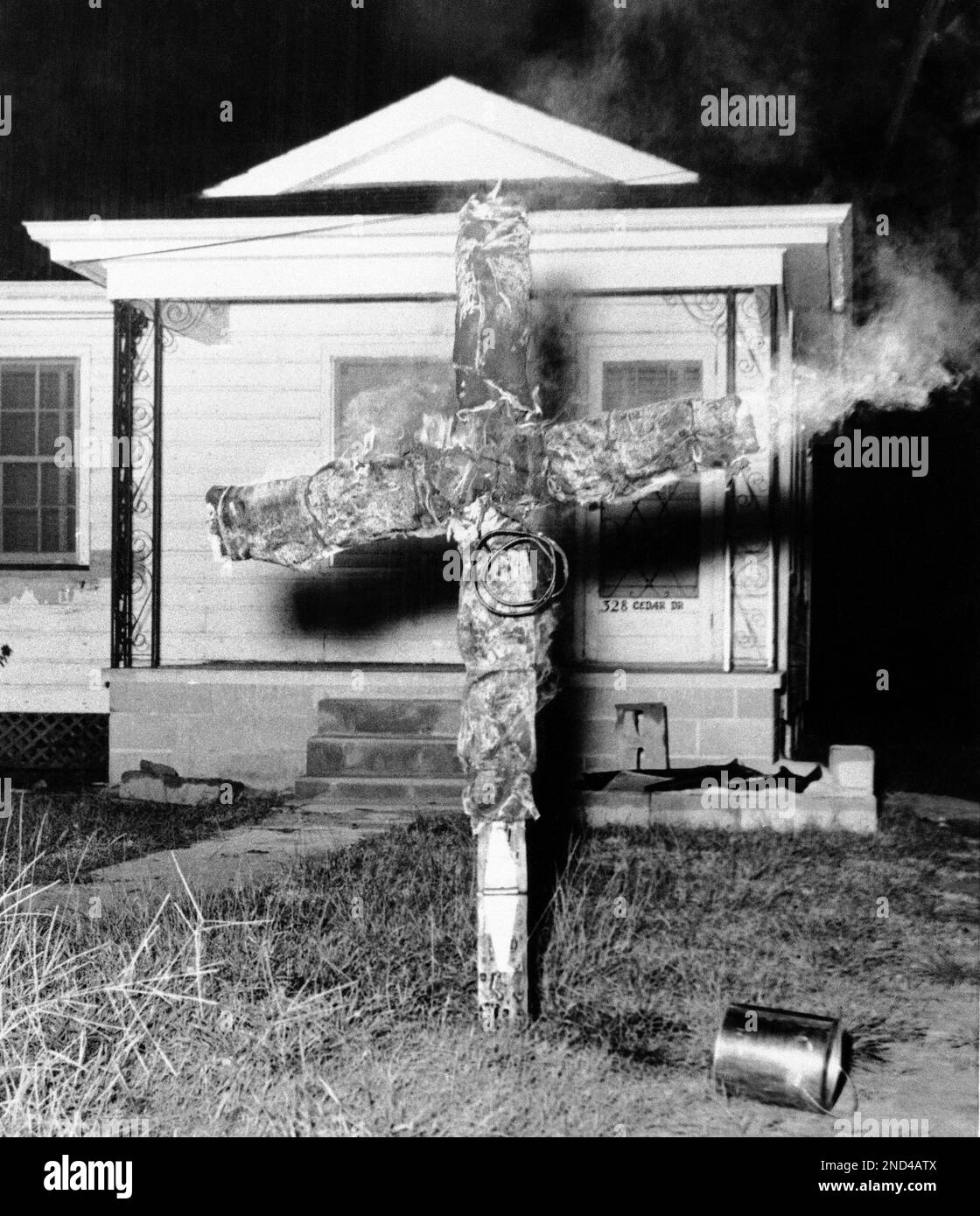 This burning cross, traditional symbol of the Ku Klux Klan, was erected ...