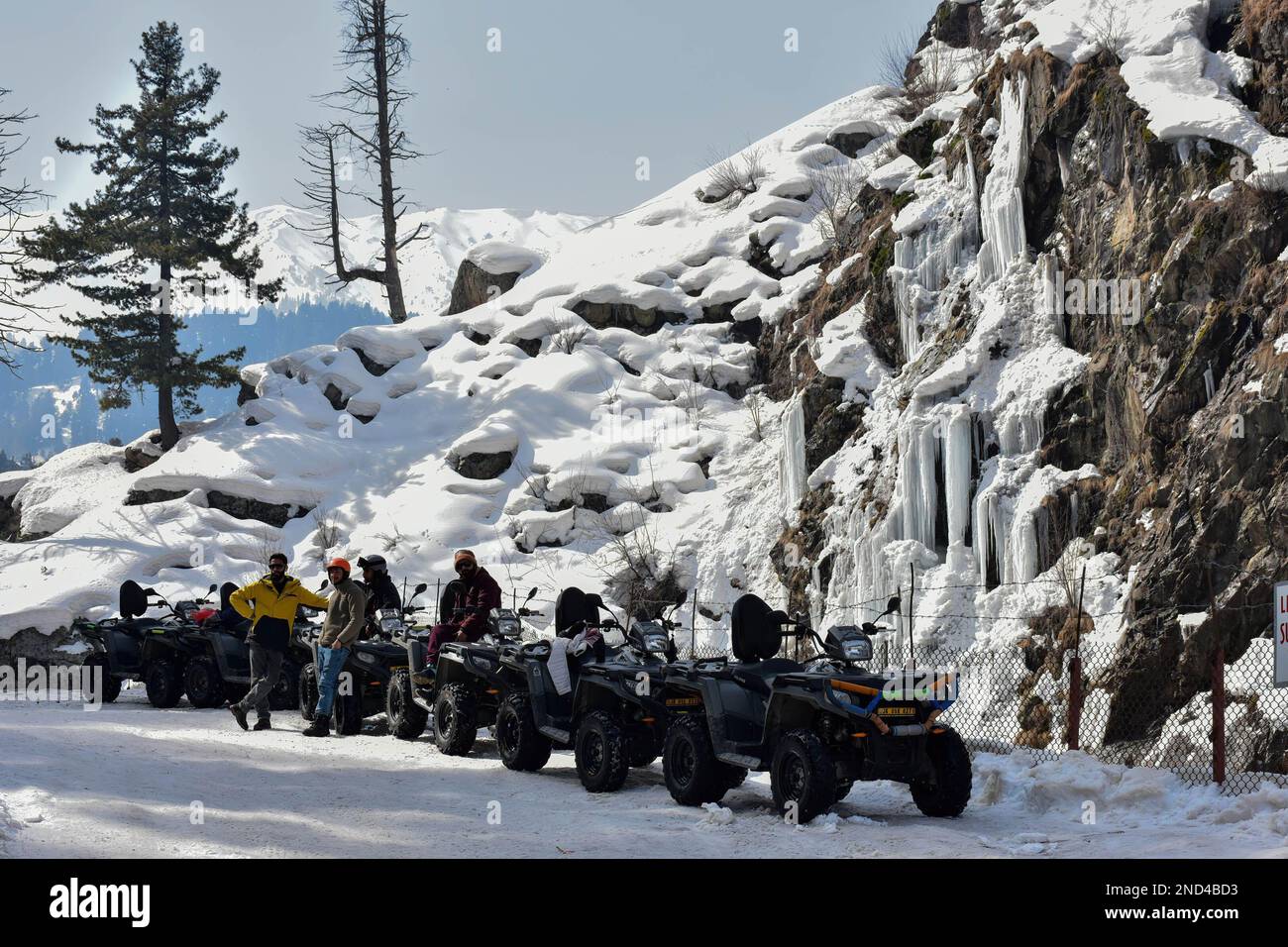 A group of ATV quad riders wait for tourists near the Drung waterfall ...
