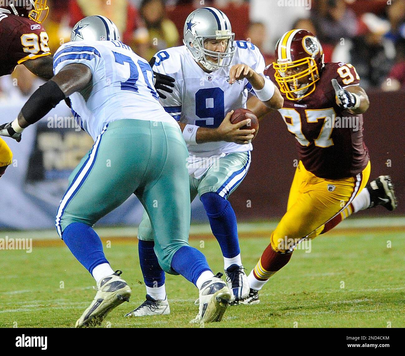 Dallas Cowboys quarterback Tony Romo scrambles out of the pocket during ...