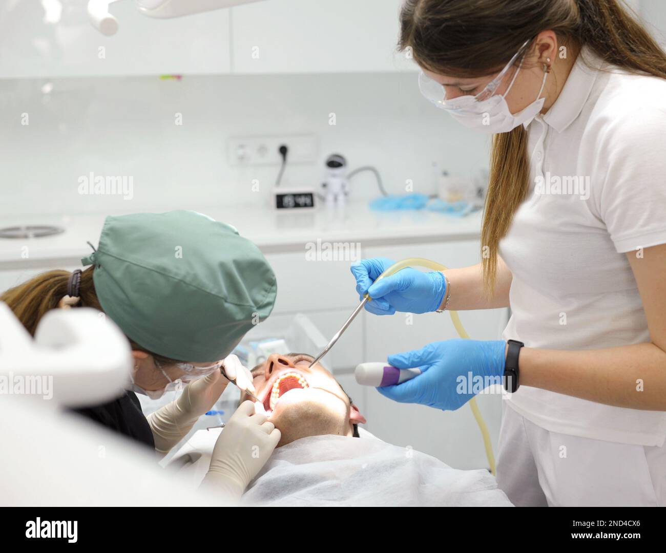 Dentist perform dental implantation operation hi-res stock photography ...