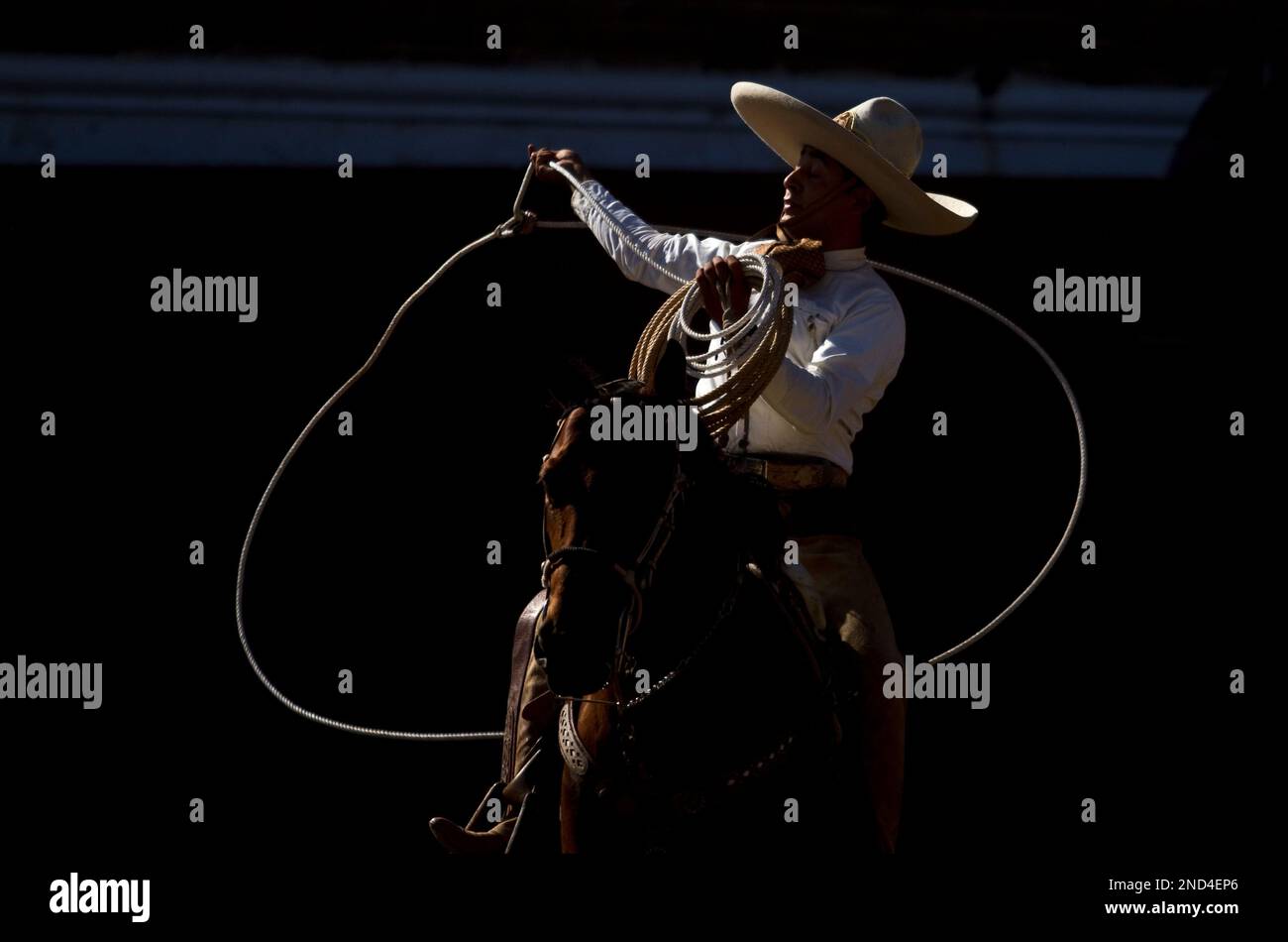 A Mexican charro performs during a Bicentennial Charreada in Tijuana ...
