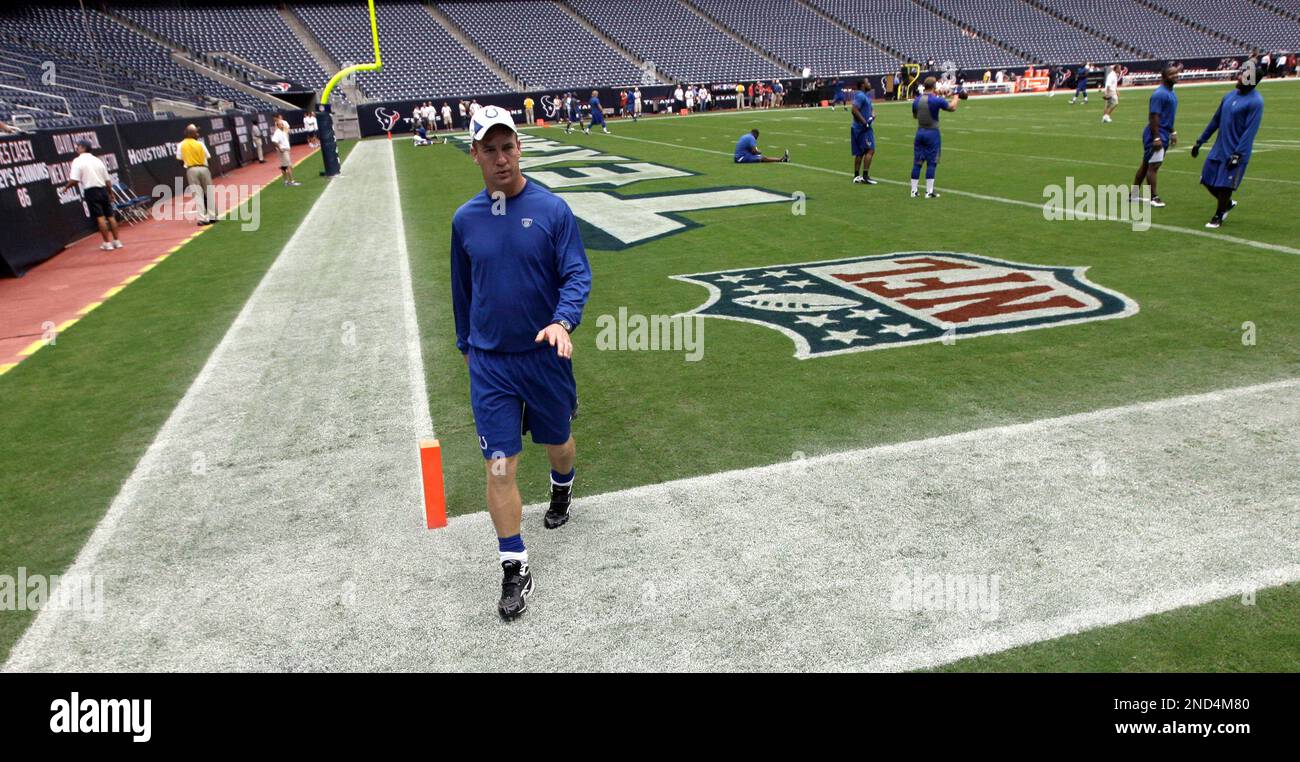 Indianapolis Colts quarterback Peyton Manning walks toward the locker ...