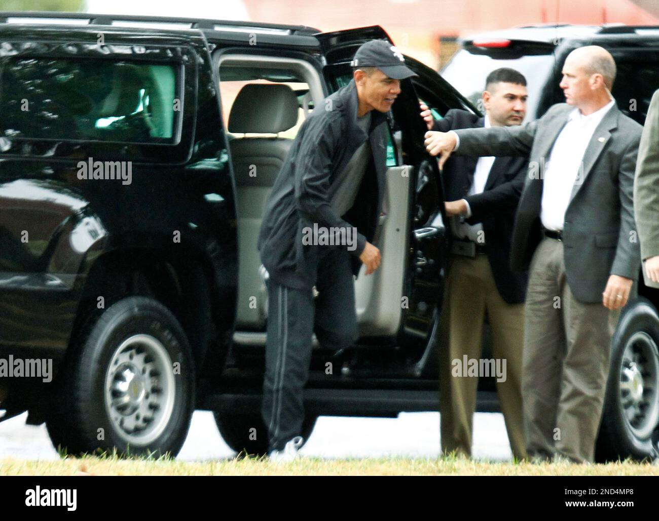 President Barack Obama gets out of his vehicle as he arrives to play ...
