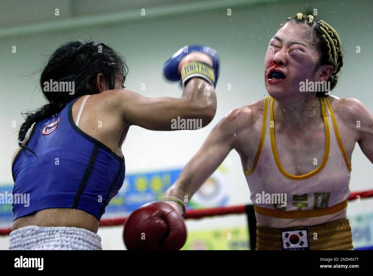 Jujeath Nagawa, left, from the Philippines sends her right to South ...